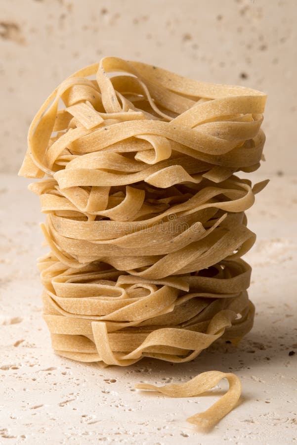 Stack of Tagliatelle Pasta stock image. Image of pasta - 85437621