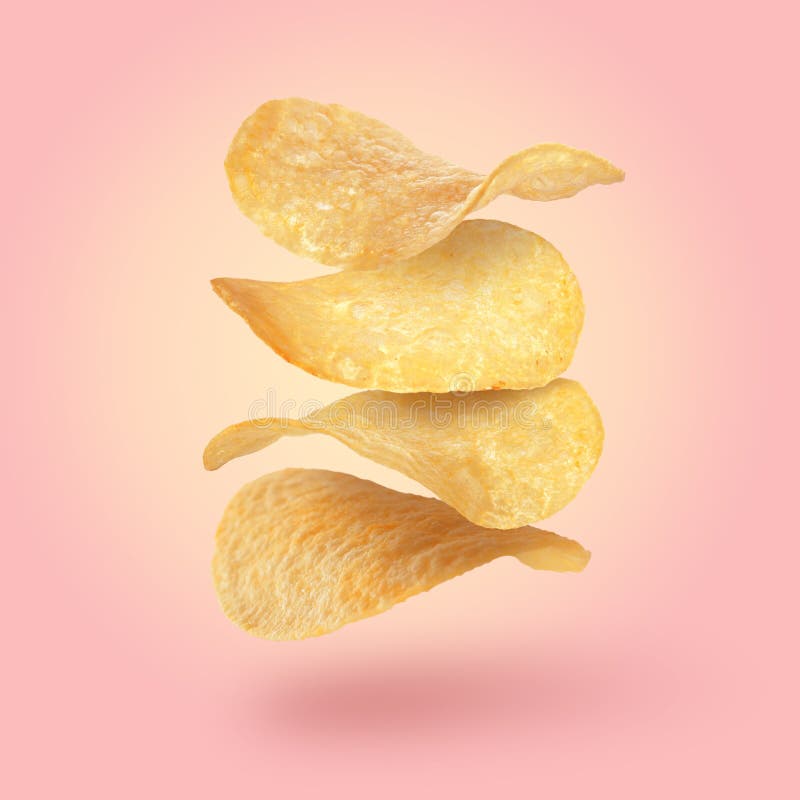 Stack of Tasty Potato Chips Falling on Pink Background Stock Photo ...