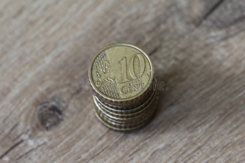 Stack of Ten Euro Cent Coins on Wooden Background Stock Photo - Image ...