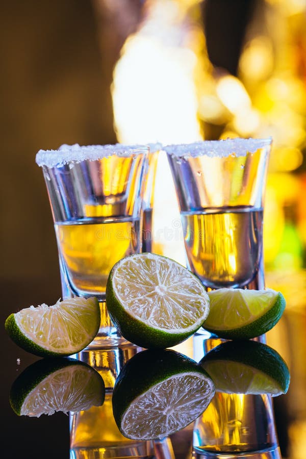 Stack of Tequila with Salt Close Up on Blurred Background Stock Image ...
