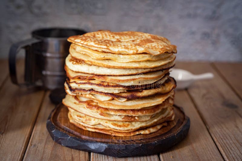 A Stack of Thin Large Pancakes on a Gray Background. a Stack of Rustic ...