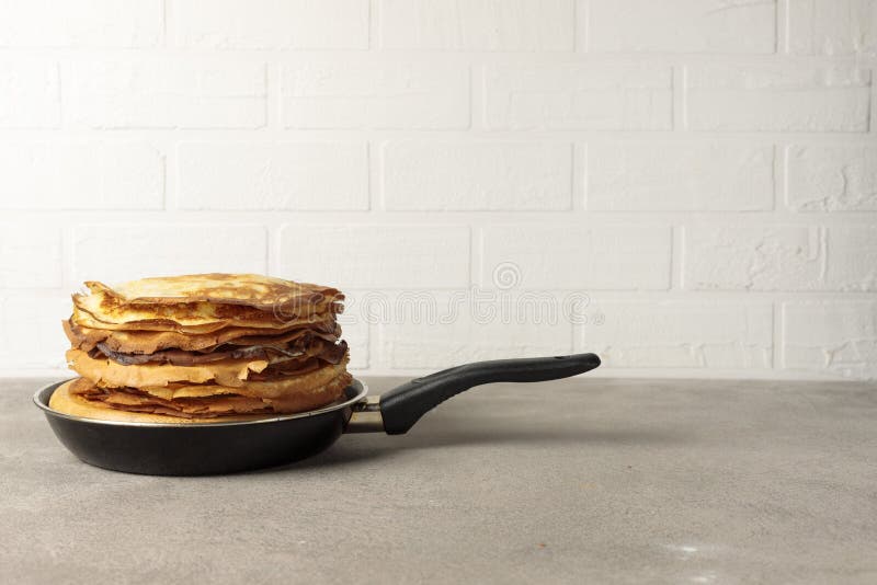 A Stack of Thin Pancakes in a Frying Pan. Horizontal with a Copy of the ...
