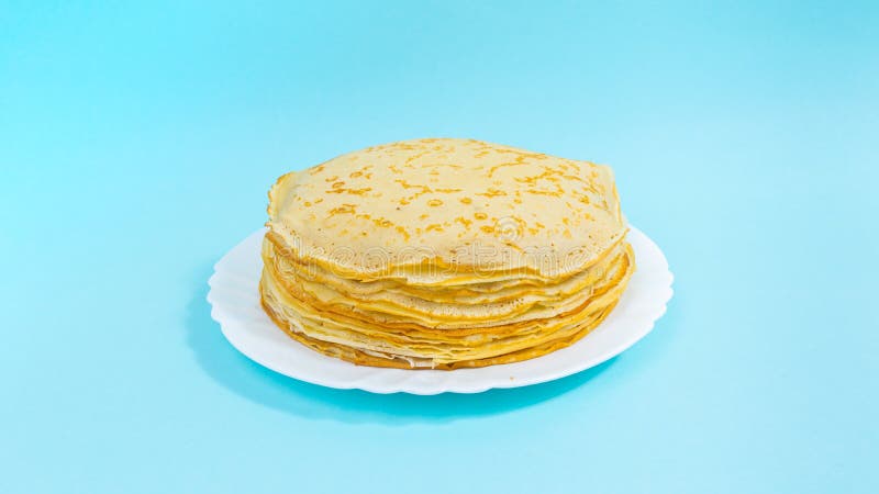 A Stack of Thin Pancakes on a White Plate. Minimalism Stock Image ...