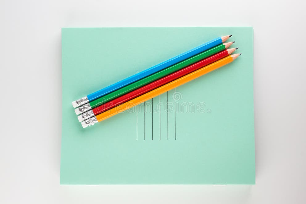Stack of Thin Student Notebooks with Colored Pencils Stock Photo ...