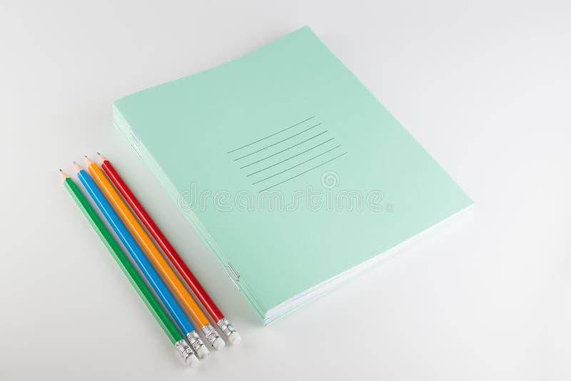 Stack of Thin Student Notebooks with Colored Pencils Stock Image ...