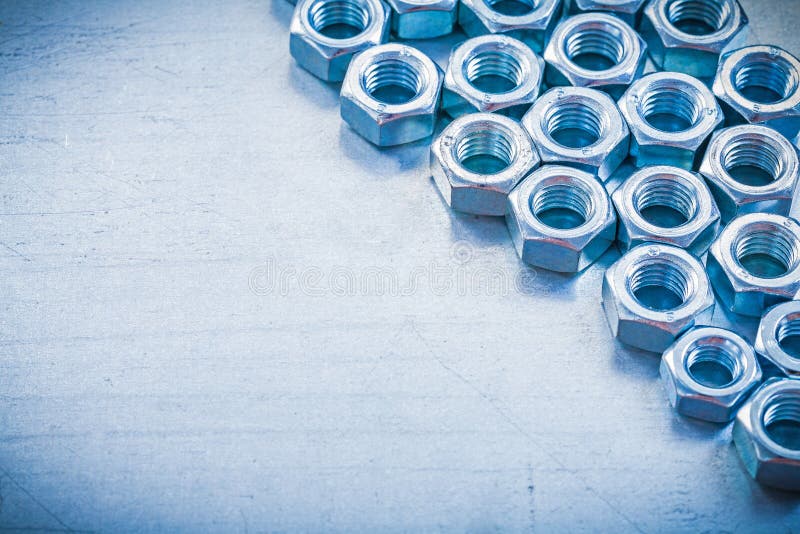 Stack of Threaded Nuts on Metallic Stock Photo - Image of tapped ...