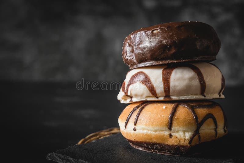 Stack of Three Different Fresh Donuts with Chocolate and Caramel ...