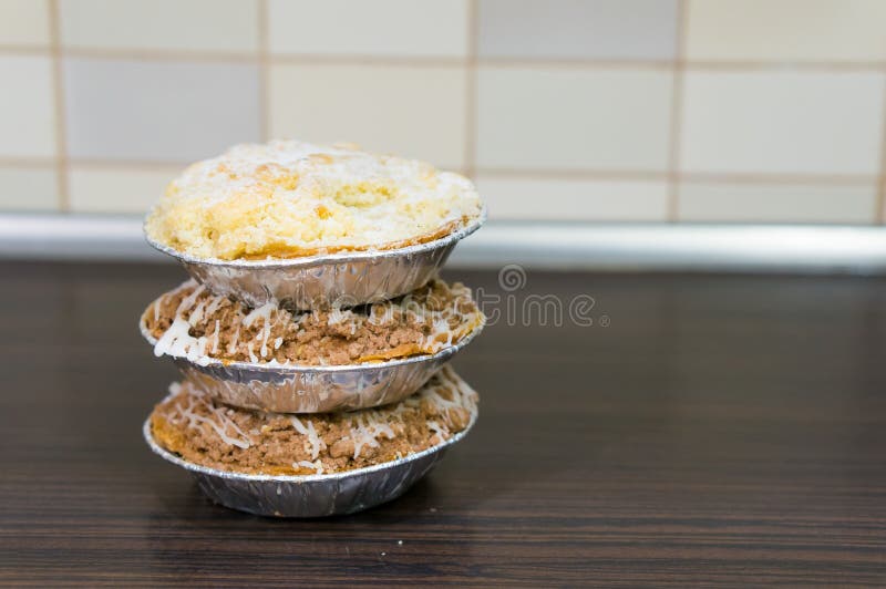 Stack of Three Different Pies on a Wooden Surface Stock Photo - Image ...