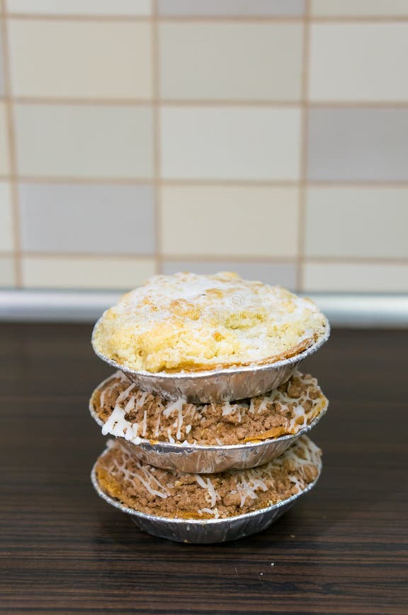 Stack of Three Different Pies on a Wooden Surface Stock Image - Image ...
