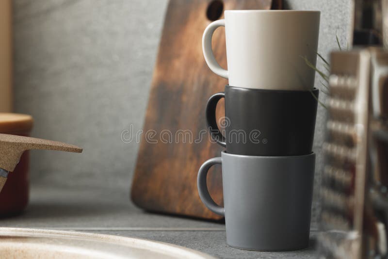 Stack of Three Grey Cups on Kitchen Counter Stock Photo - Image of ...