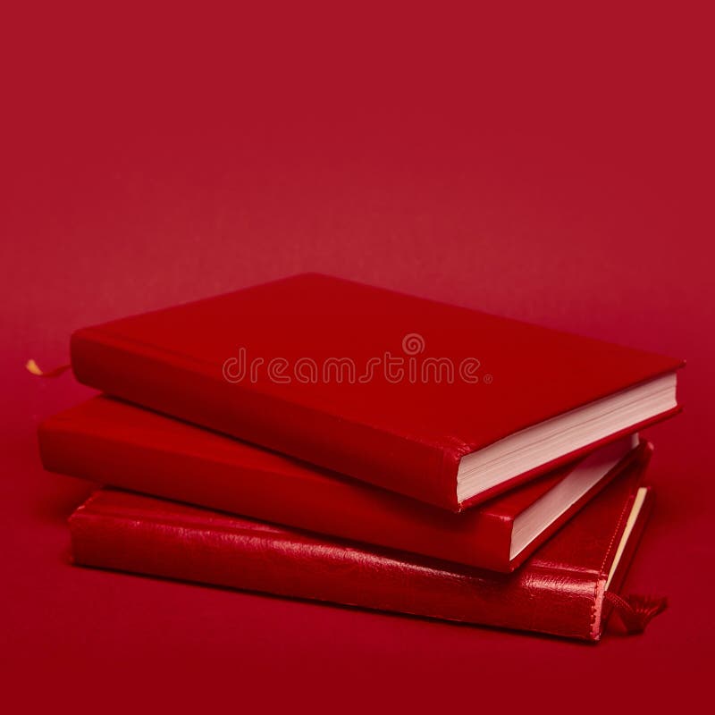 Stack of Three Red Hardback Books Placed on Red Backdrop. Minimalism ...