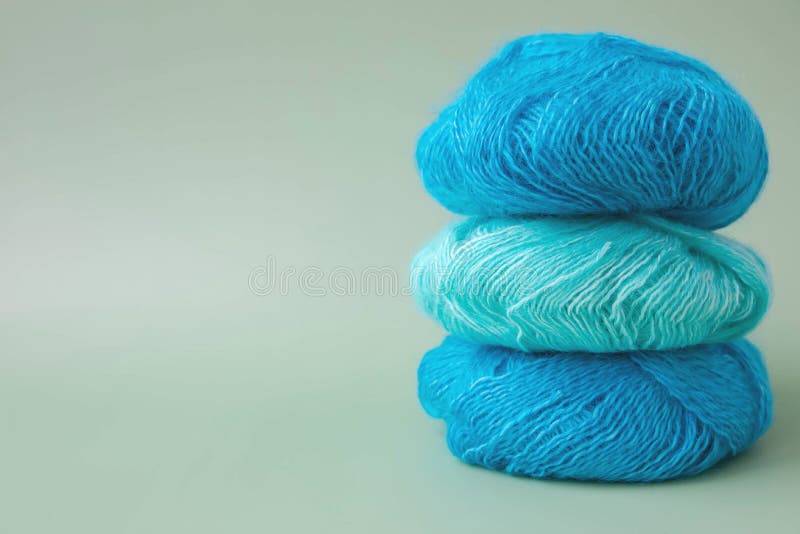A Stack of Three Skeins of Blue-tinged Yarn Knitting Aesthetics Stock ...