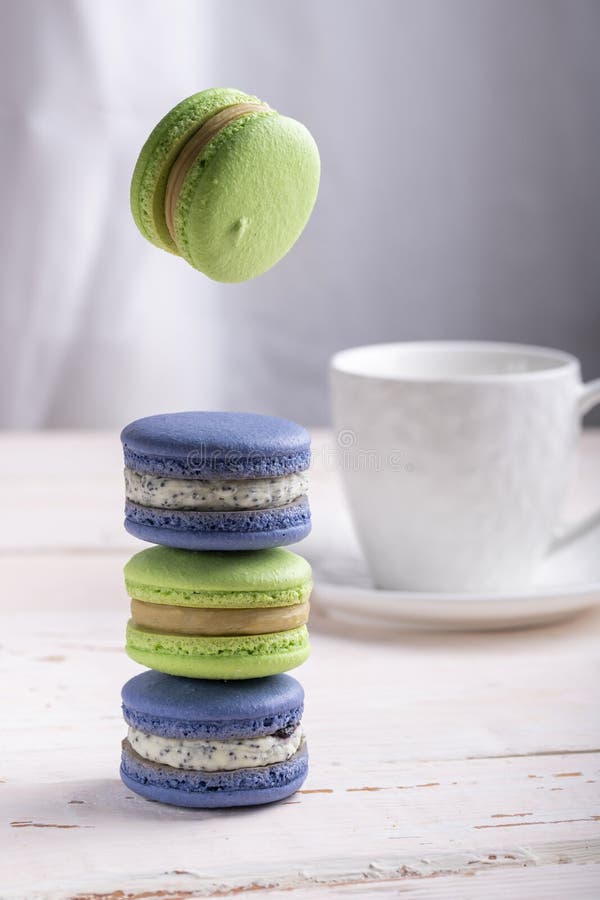 Stack, Tower of Colored Macaroons and White Cup on a Light Background ...