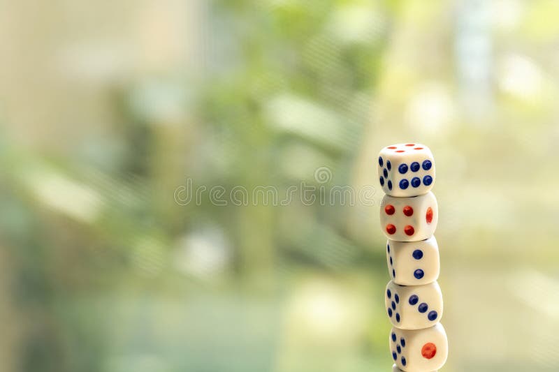 Stack Tower of Many Small Game Dice Isolated on a Bright Blurred ...
