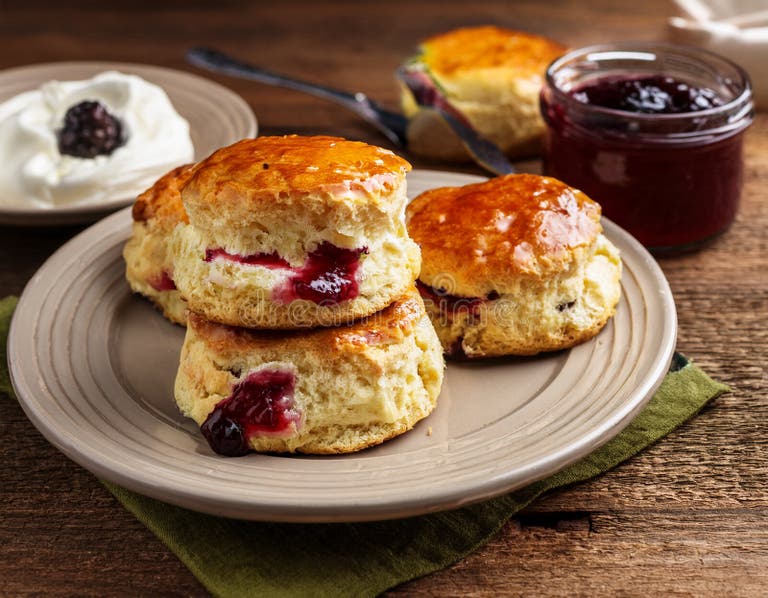 Stack of Traditional British Scones Served with Jam and Cream on a ...