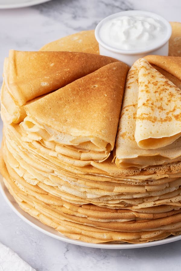 Stack of Traditional Russian Pancakes Blini with Sour Cream on Marble ...