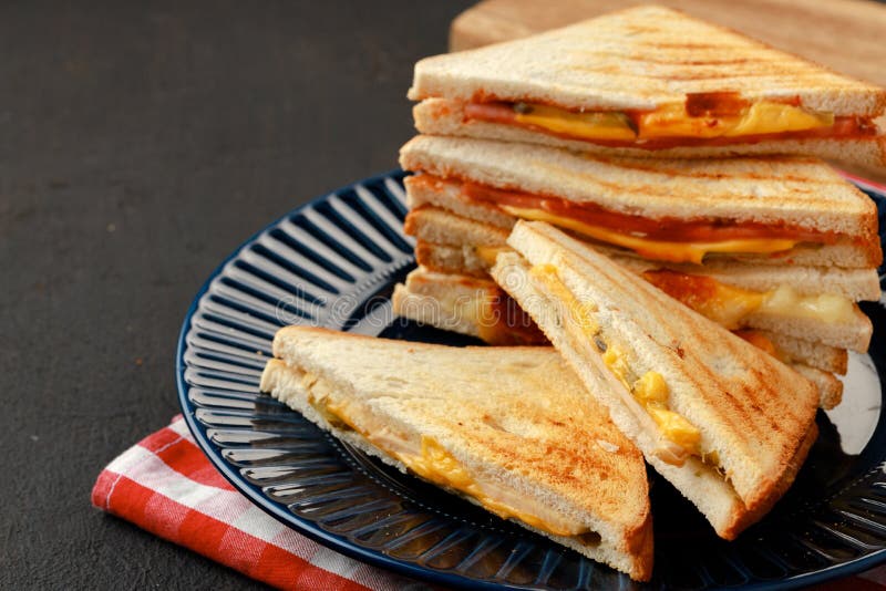 Stack of Triangle Sandwiches in Plate Close Up Stock Photo - Image of ...