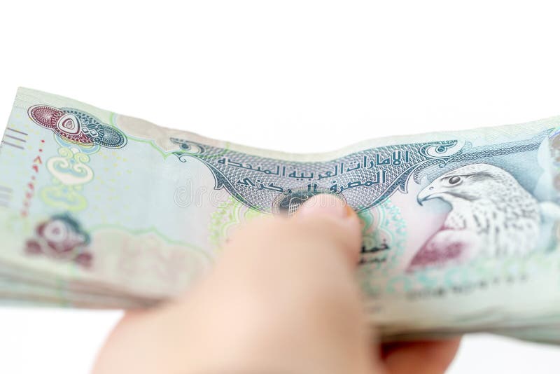 Stack of UAE Dirhams in Woman`s Hands, Paper Money, Close Up. Stock ...
