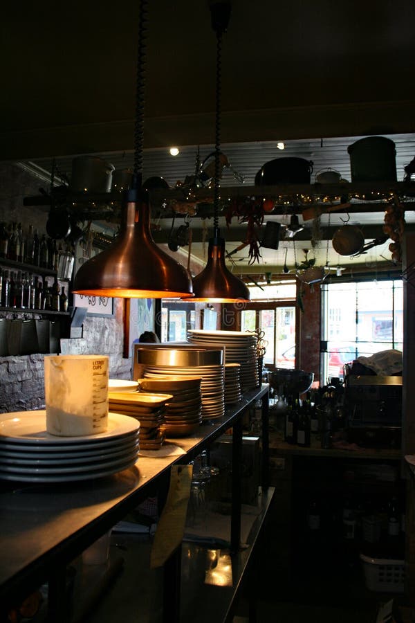 Stack Up Plates in a Small Dark Restaurant Kitchen Stock Photo - Image ...