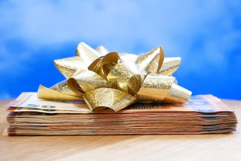 Stack of Usa Dollars and Bow on Blue Sky Background, Money Gift Concept ...