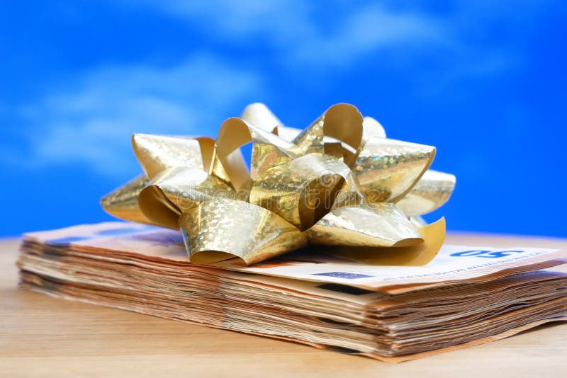 Stack of Usa Dollars and Bow on Blue Sky Background, Money Gift Concept ...