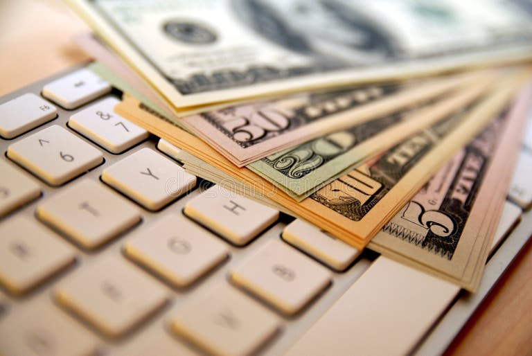 A Stack of USD American Dollar Bills on a Computer Keyboard Stock Photo ...