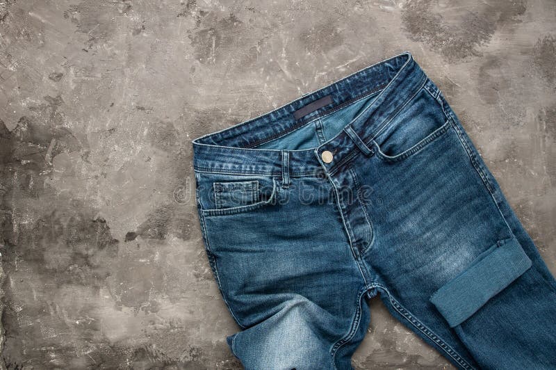 Stack of Various Denim Jeans, Trousers on Stone Rustic Background Stock ...