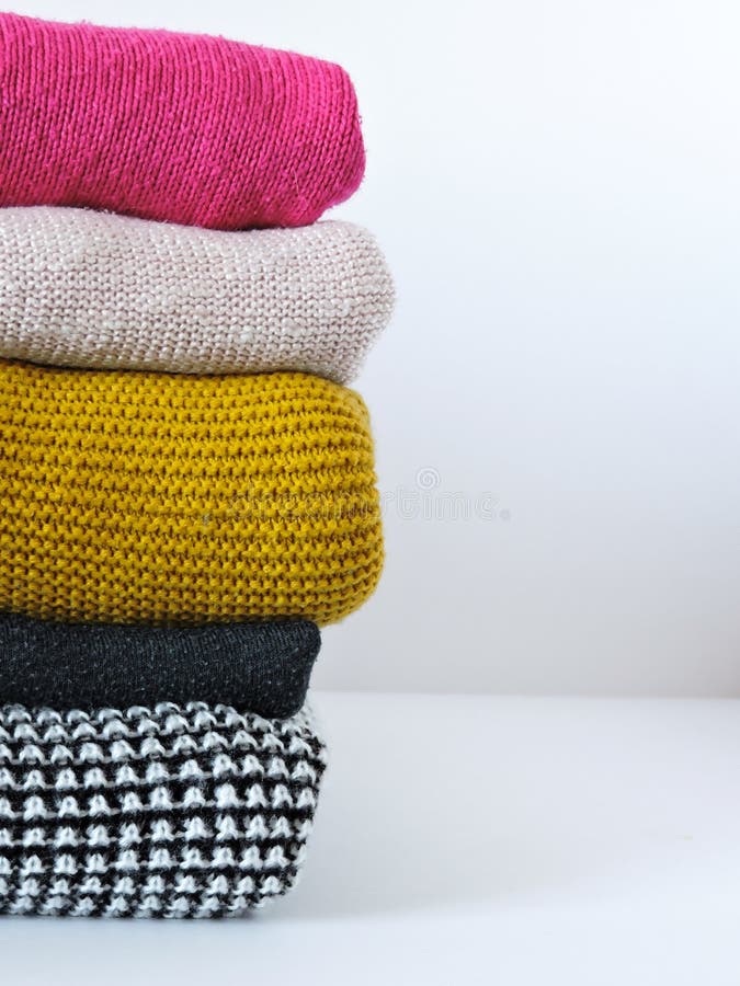 Stack of Various Sweaters Isolated on White Background. Knitted Wool ...
