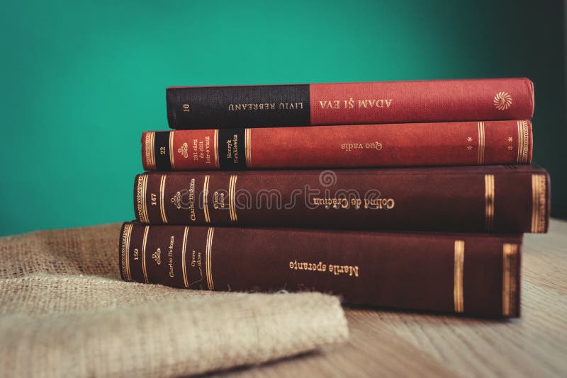 Stack of Vintage Books on a Blue Background Editorial Stock Photo ...