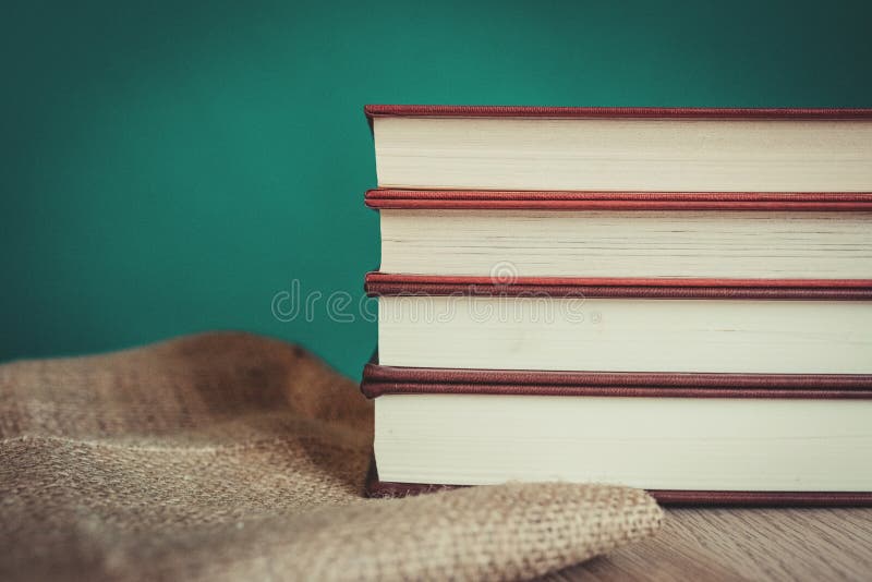 Stack of Vintage Books on a Blue Background Stock Image - Image of ...