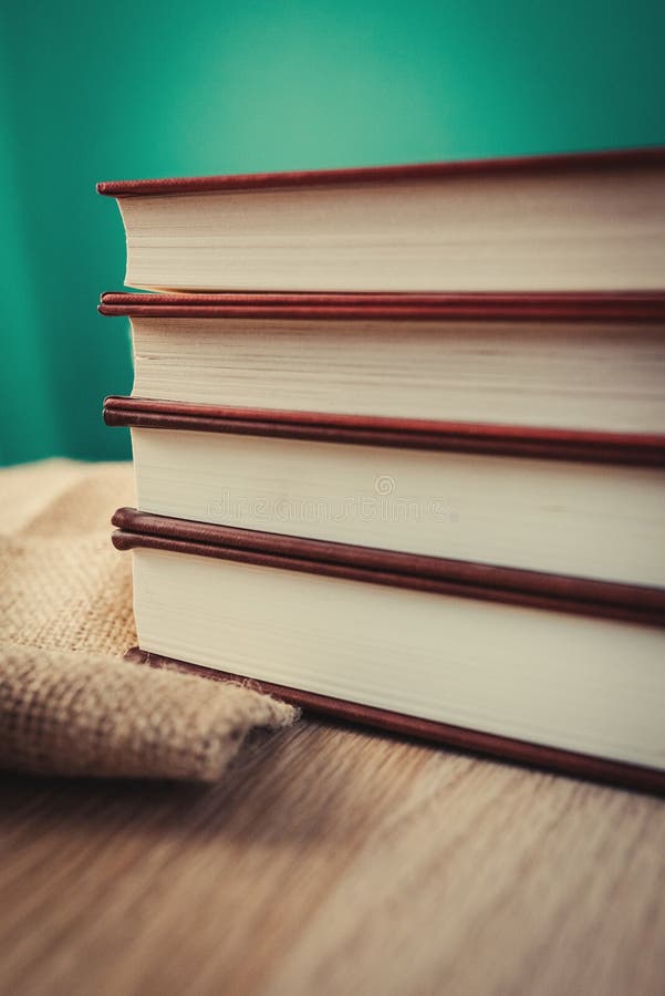 Stack of Vintage Books on a Blue Background Stock Image - Image of ...