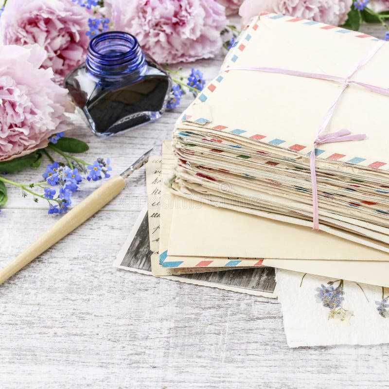 Stack of Vintage Love Letters and Pink Peonies in the Background Stock ...