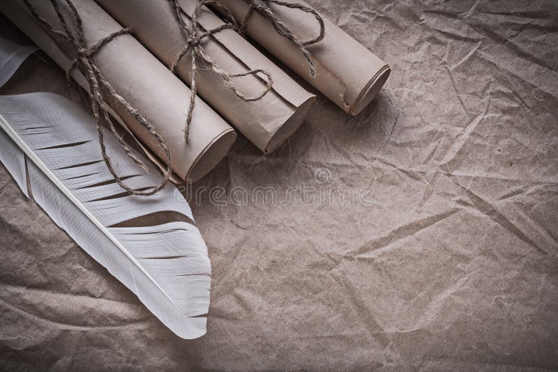 Stack of Vintage Paper Scrolls Quill on Crumpled Wrapping Sheet Stock ...