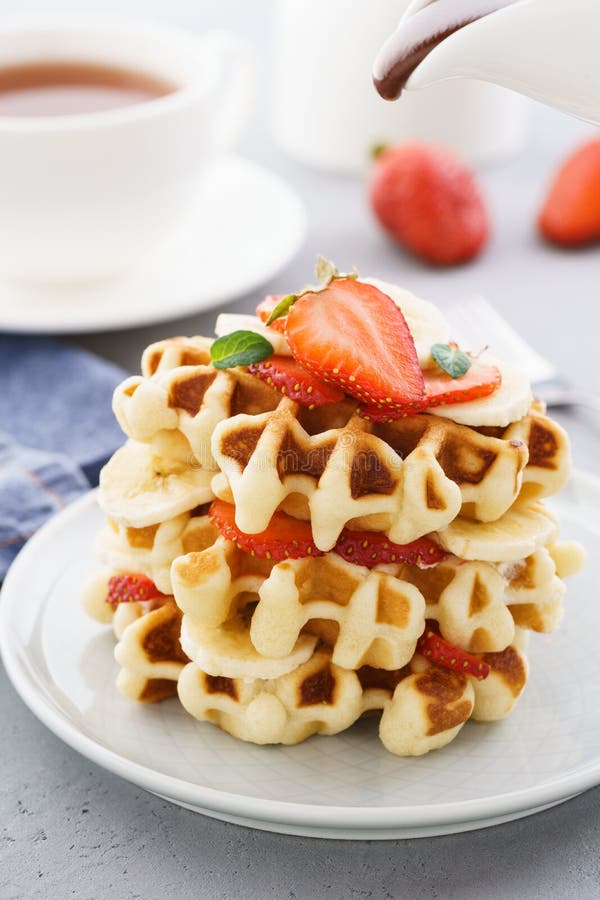 Stack of Waffles with Banana, Strawberry and Flowing Chocolate Stock ...