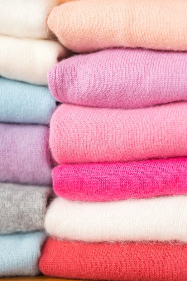 A Stack of Knitted Sweaters of Different Colors Lies. Stock Photo ...