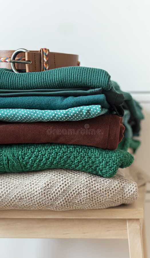 Stack of Warm Wool and Cotton Clothes with the Belt. Textile Texture ...