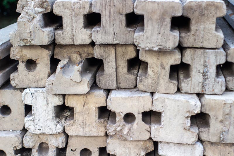 Stack of Weathered Concrete I-beams Showcasing Industrial Texture ...
