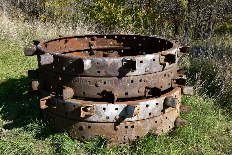 Stack of Wheels for Old Tractors Left on the Grass Stock Photo - Image ...