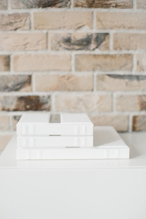 Stack of White Books on Brick Wall Background Stock Image - Image of ...