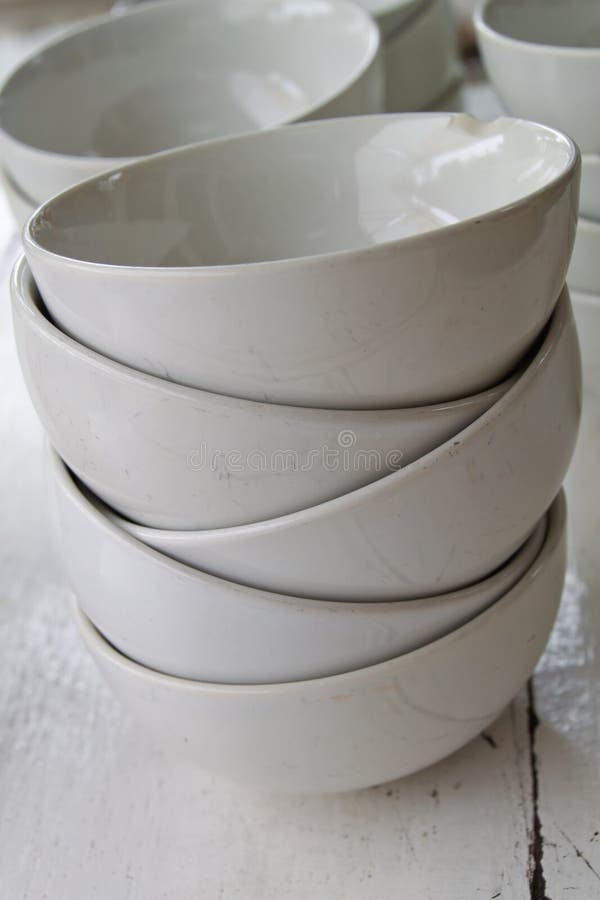 Stack of white bowls stock image. Image of pile, ceramic - 29341357