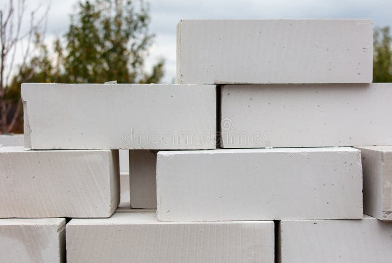 A Stack of White Bricks with a Grey Brick in the Middle Stock Photo ...