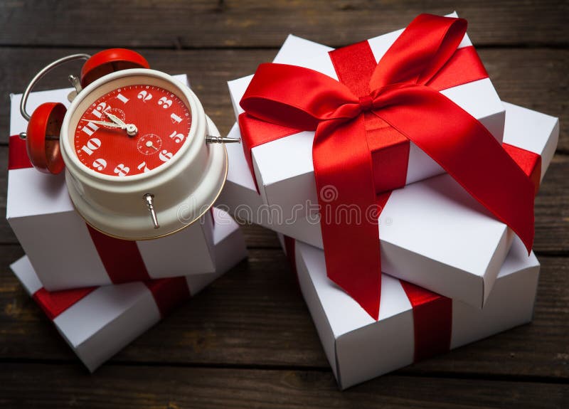 Stack of White Christmas Presents on Dark Wood Background Stock Photo ...