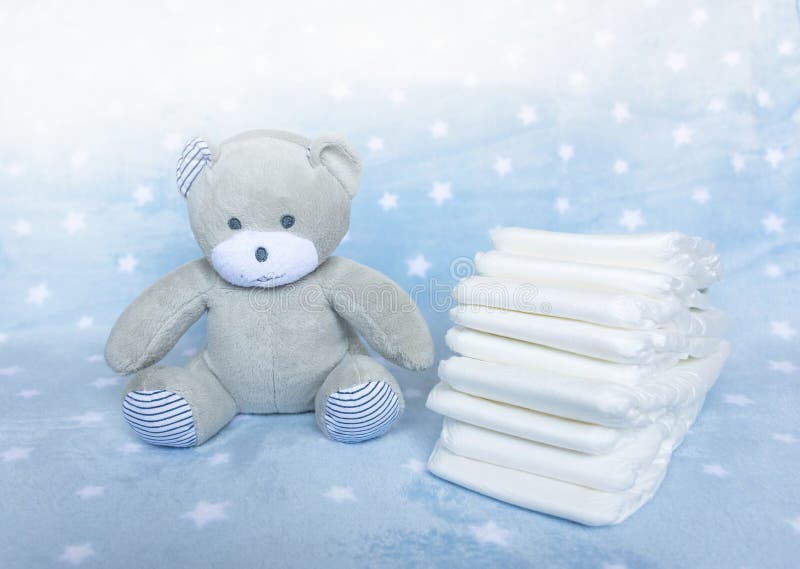 Stack of White Disposable Diapers for Little Babies on Blue Background ...