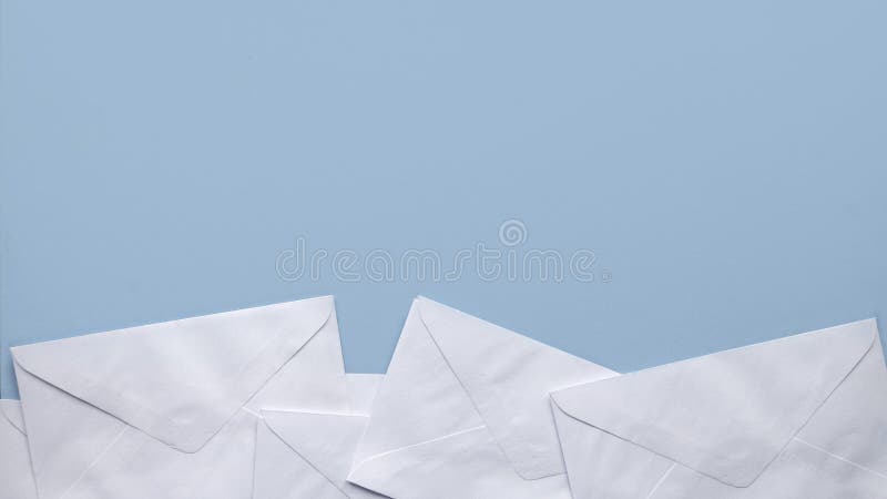 A Stack of White Envelopes on Blue Background with Copy Space Stock ...