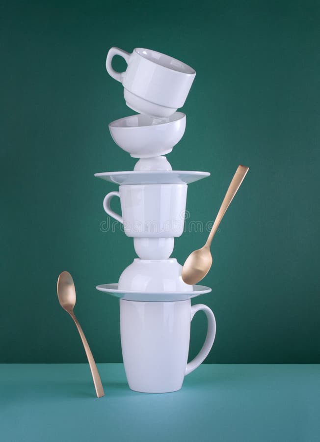 Stack of White Mugs, Plates, Salad Bowls, Saucers and Spoons. Stock ...