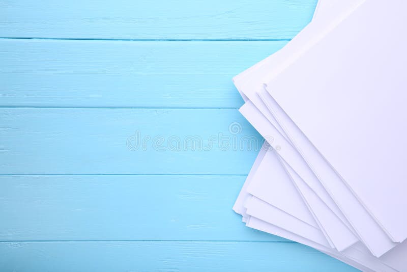 Stack White Paper on Blue Wooden Background with Clipping Path Stock ...