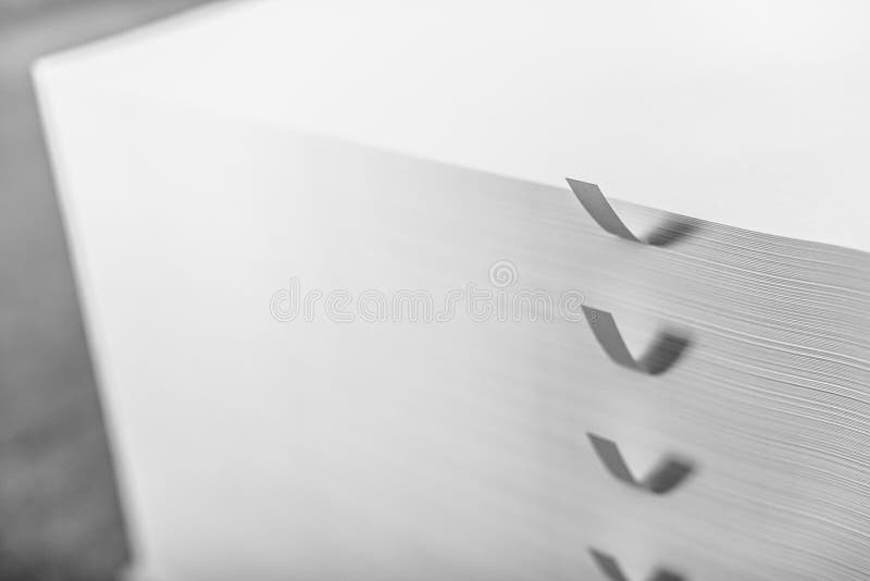 A Stack of White Paper with Bookmarks. Paper Texture Background Stock ...