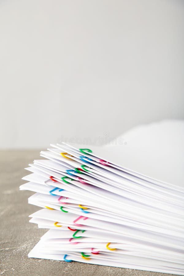 Stack of White Paper with Clips on Grey Background. Vertical Foto Stock ...