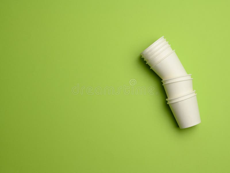 Stack of White Paper Cups on a Pink Background Stock Photo - Image of ...
