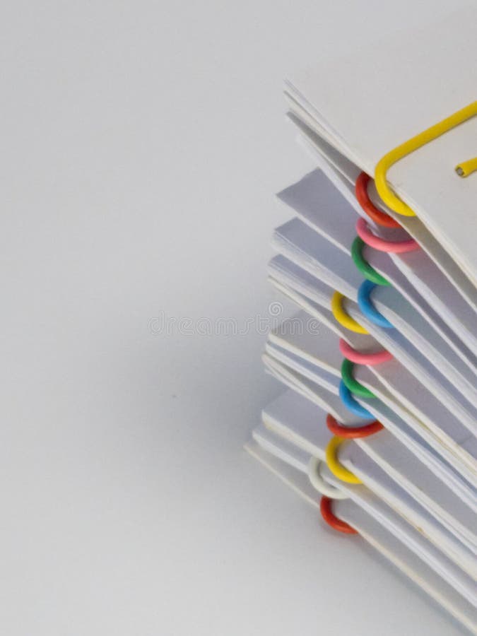 Stack of White Paper Documents Held Together with Colorful Paper Clips ...